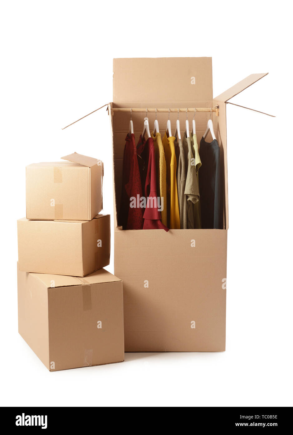 Wardrobe boxes with clothes on white background Stock Photo - Alamy
