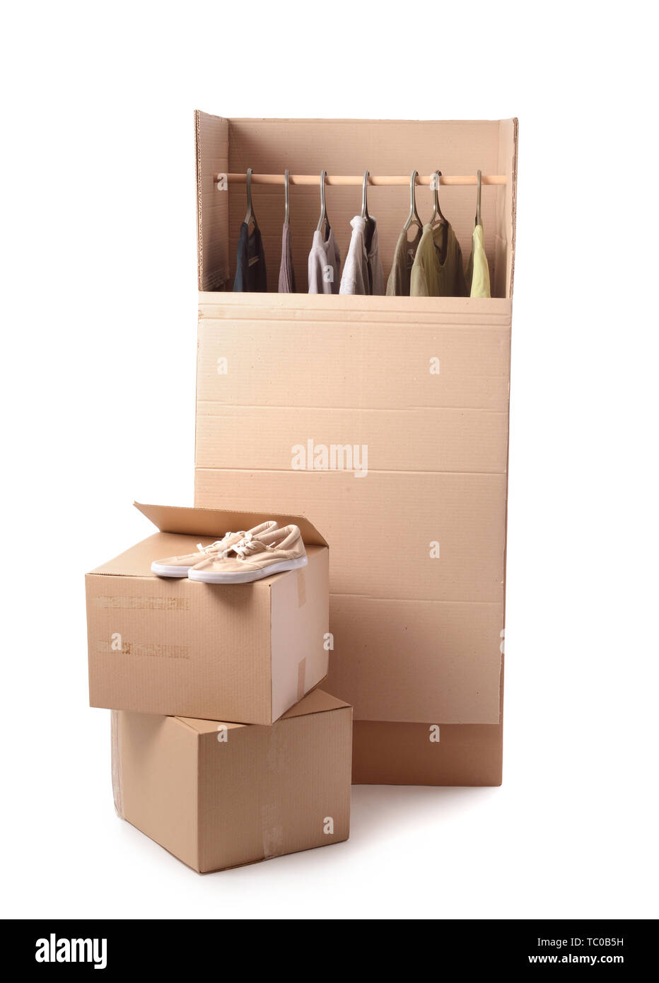 Wardrobe boxes with clothes on white background Stock Photo - Alamy