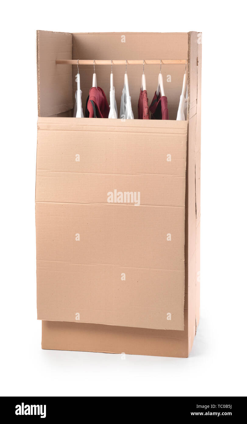 Wardrobe box with clothes on white background Stock Photo - Alamy