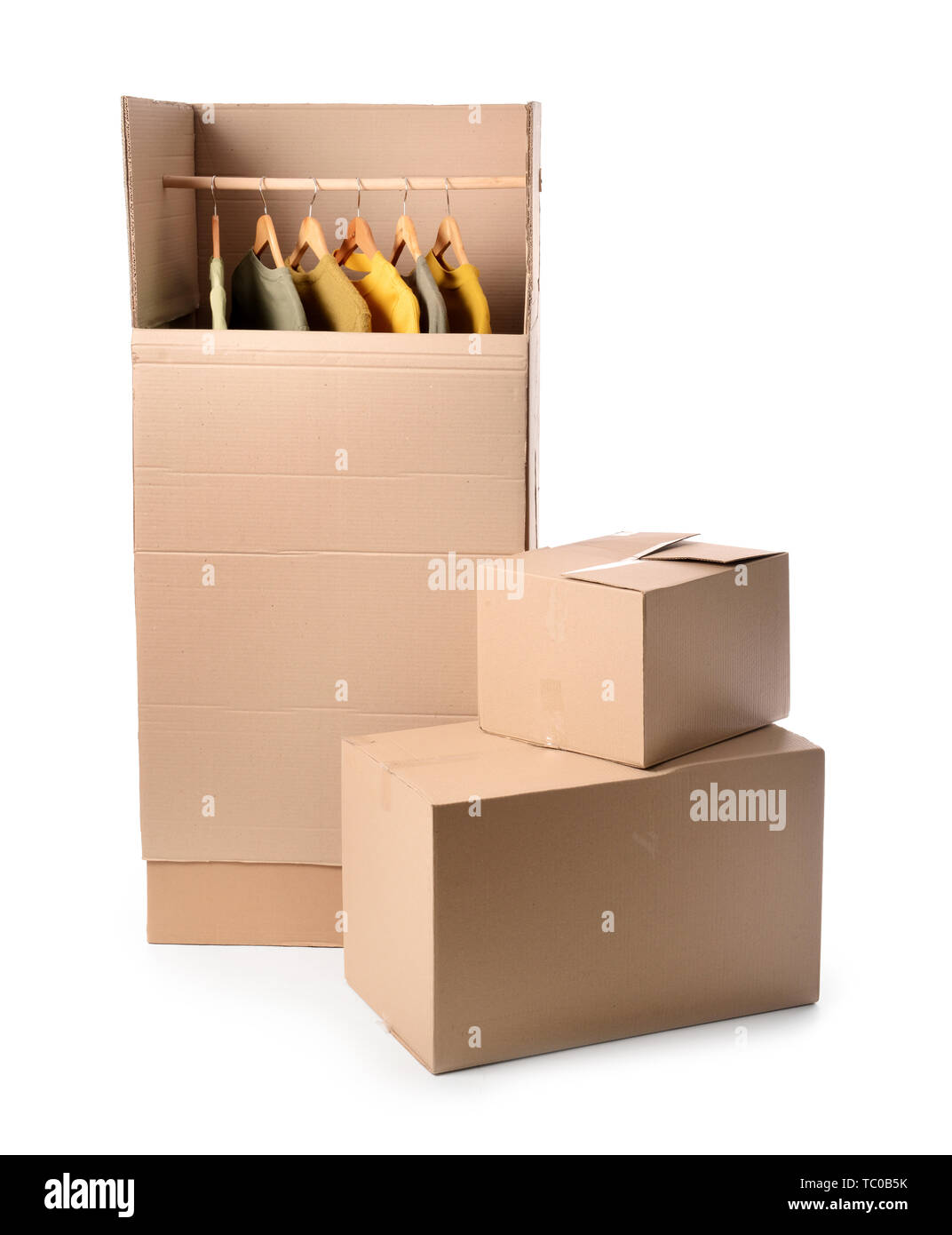 Wardrobe boxes with clothes on white background Stock Photo - Alamy