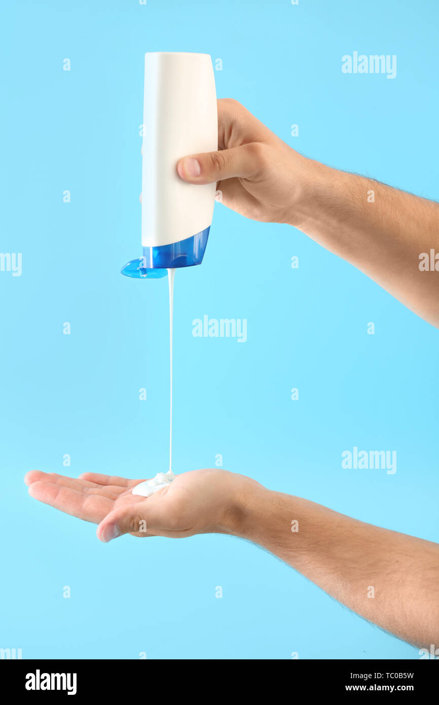 Man is pouring shampoo on his hand hi-res stock photography and images ...