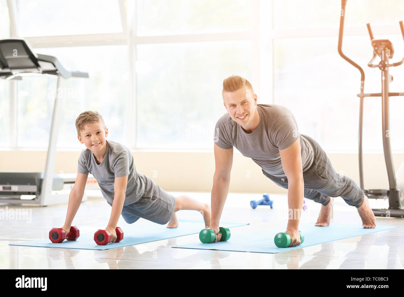 Father and son training together in gym Stock Photo - Alamy