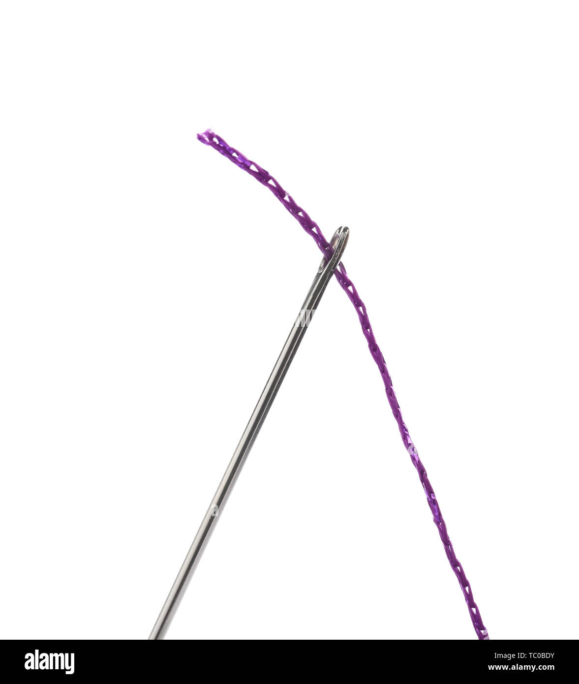 Needle with sewing thread on white background Stock Photo - Alamy
