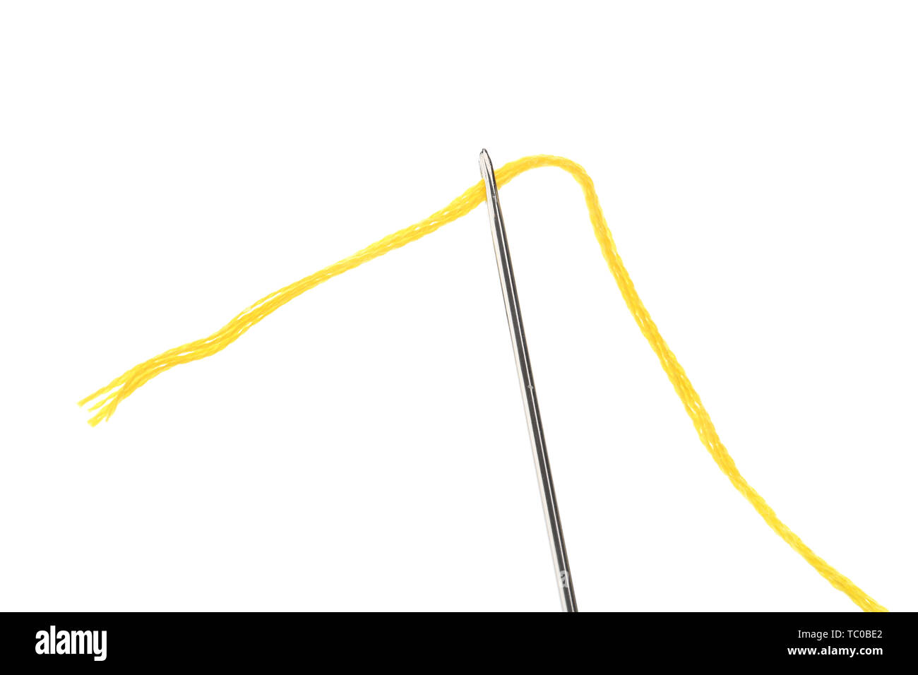 Needle with sewing thread on white background Stock Photo - Alamy