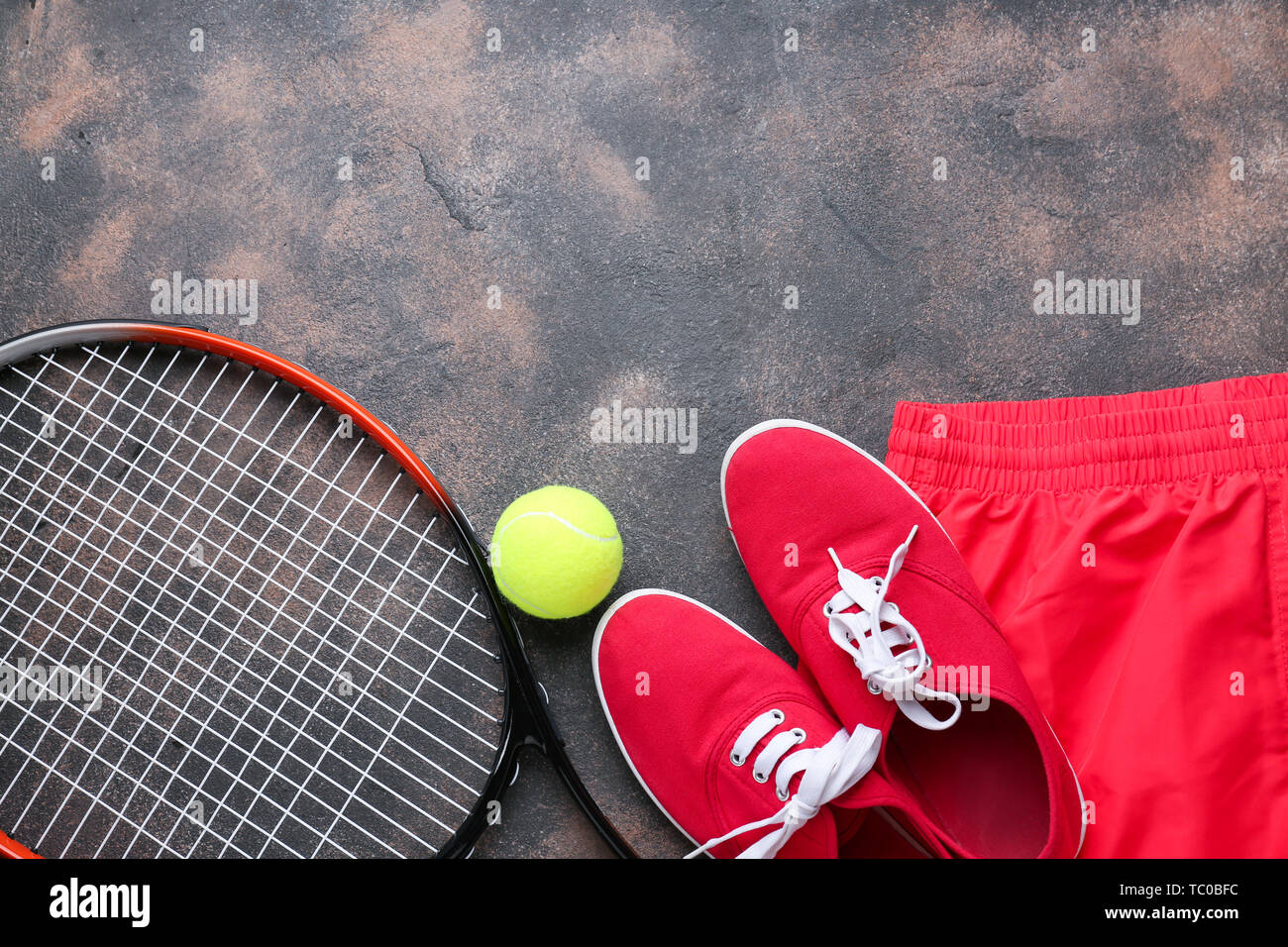 Tennis racket, shoes, clothes and ball on grunge background Stock Photo ...