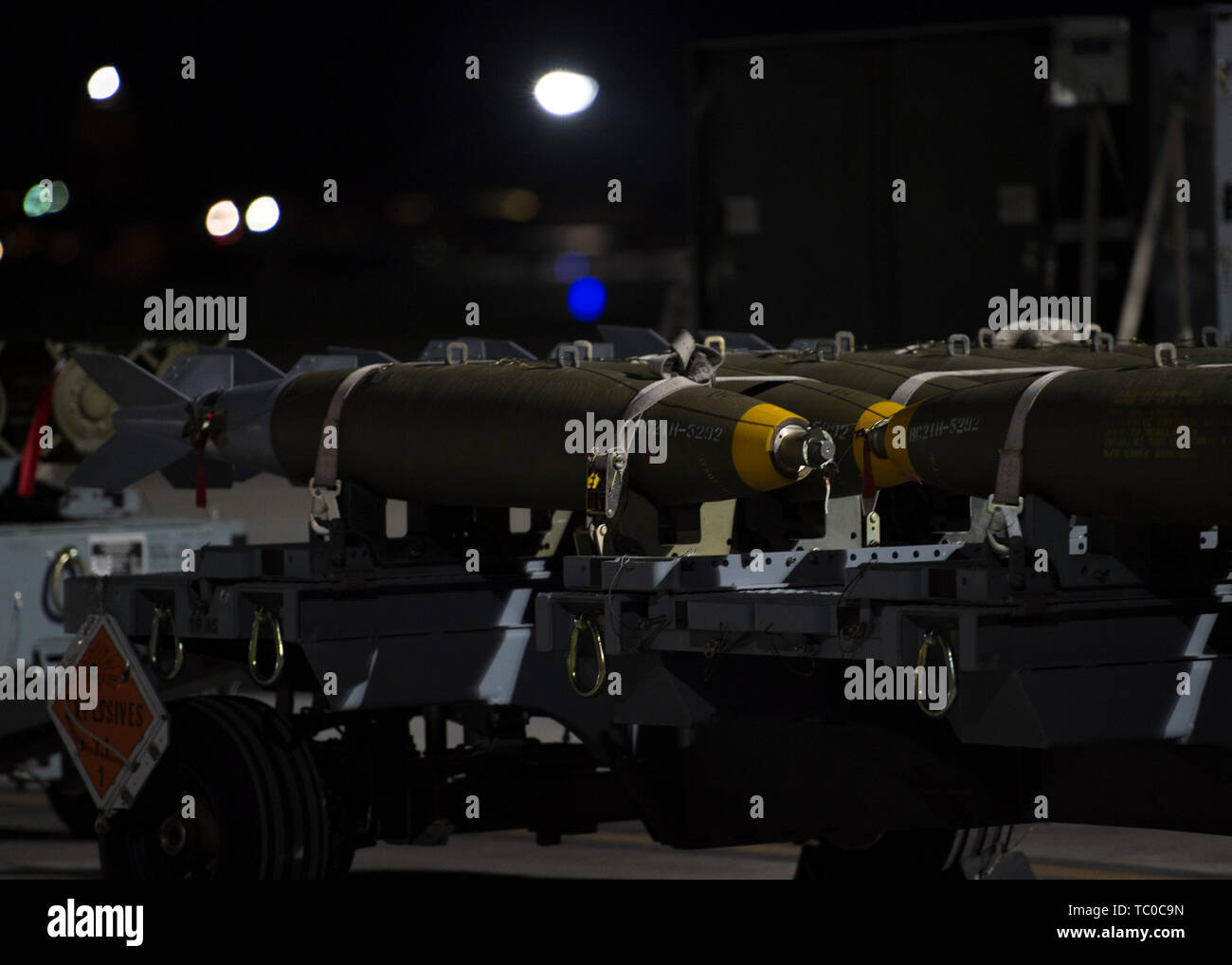 Multiple MK-82 500lb General Purpose bombs are parked on the flightline ...