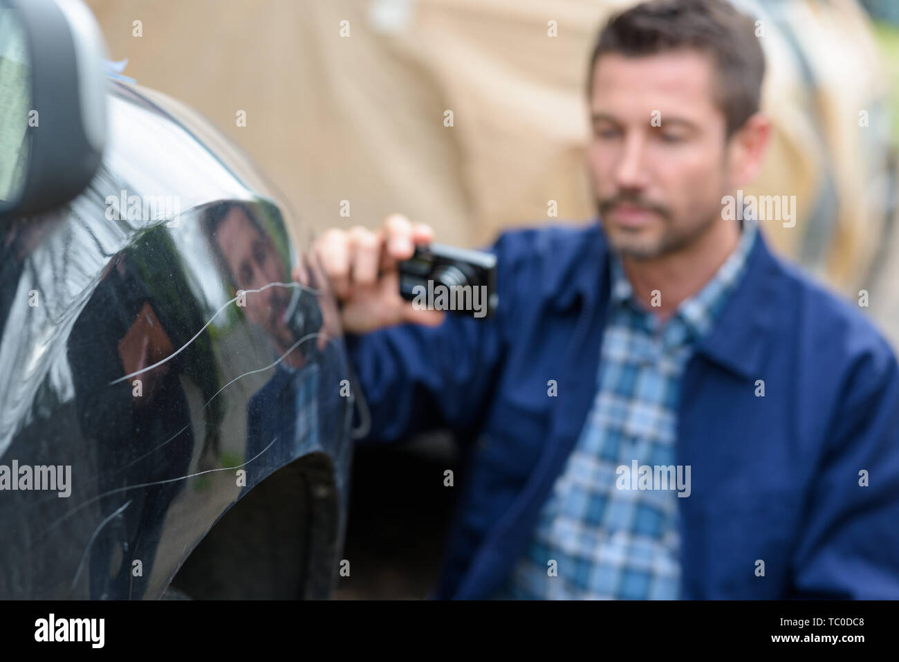 a man photographed his vehicle with accidental damage Stock Photo - Alamy
