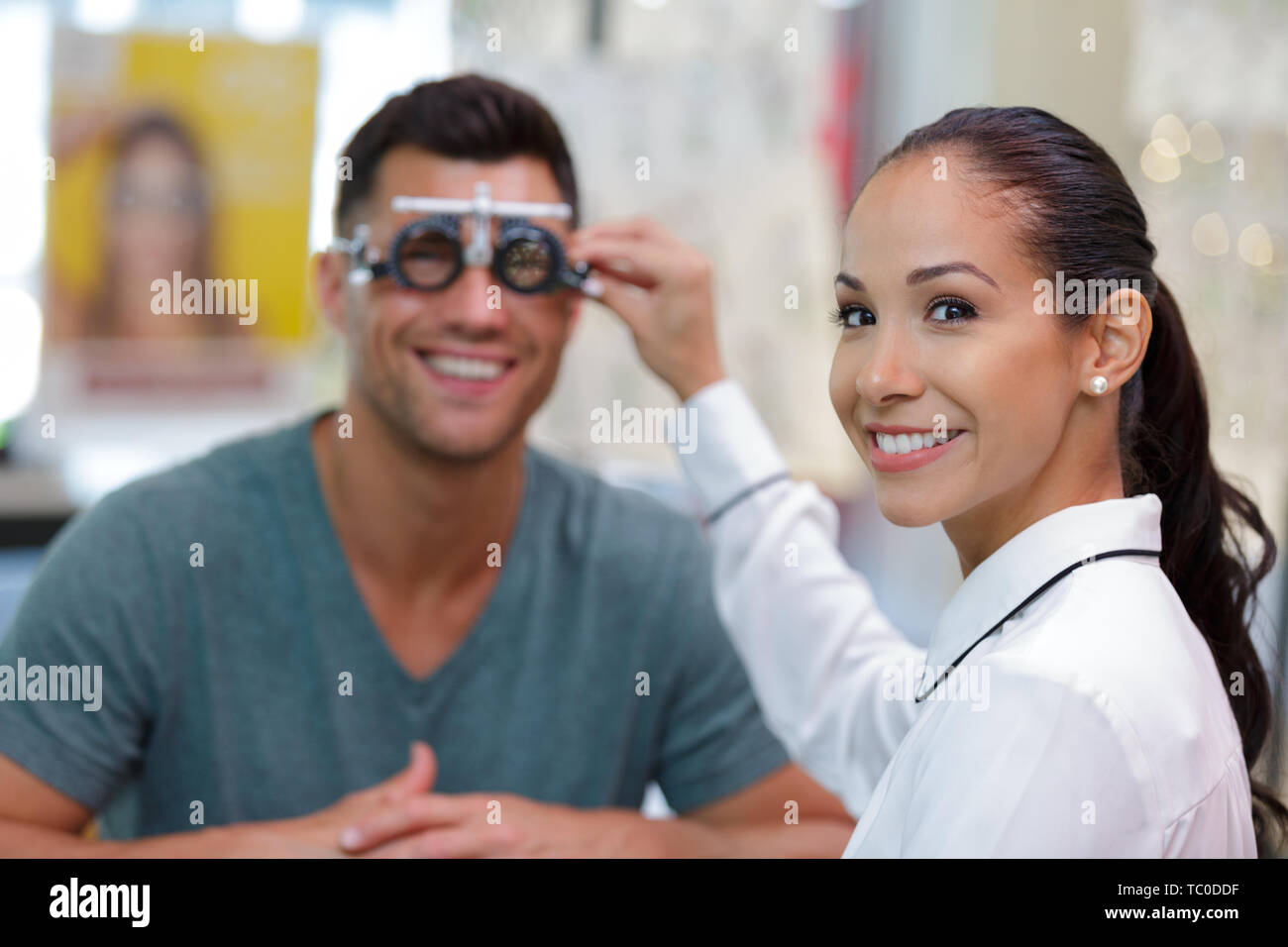 female optician in surgery doing an eye test Stock Photo - Alamy