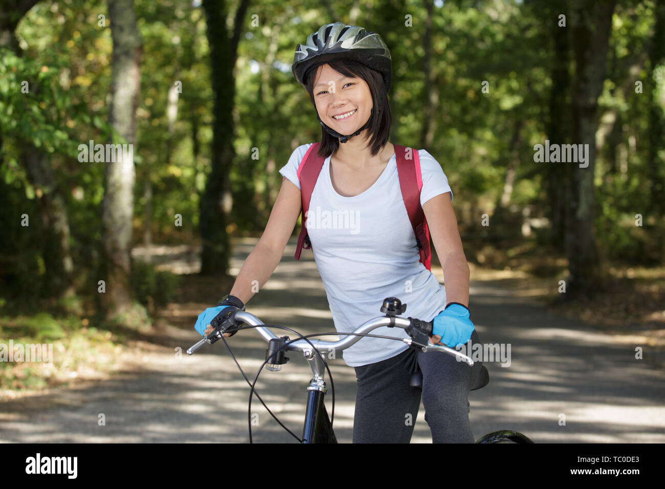 pretty young female biker outdoors Stock Photo - Alamy