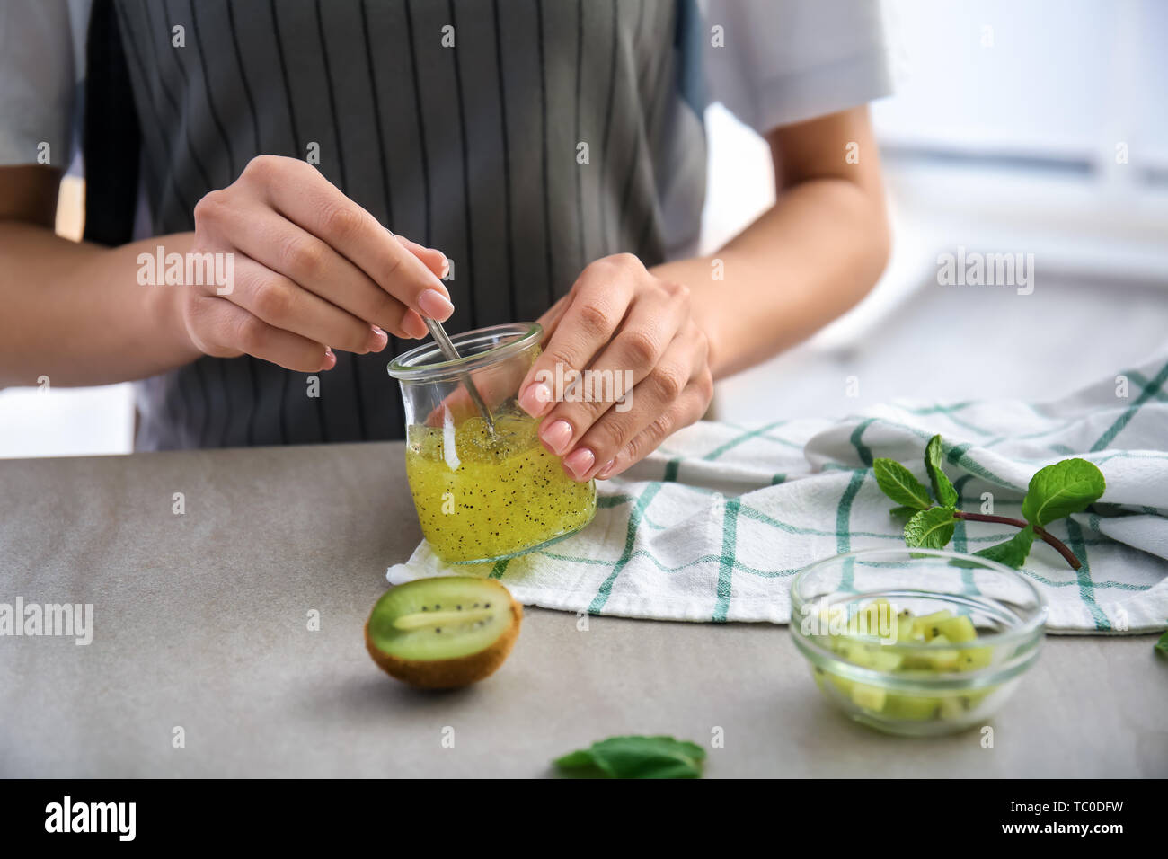 Woman preparing body scrub at table Stock Photo - Alamy