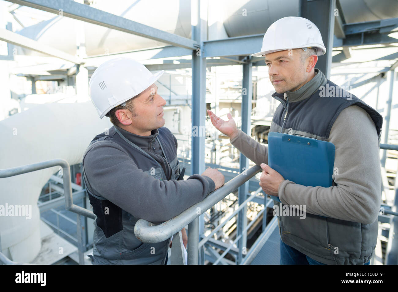 industrial engineers talking Stock Photo - Alamy