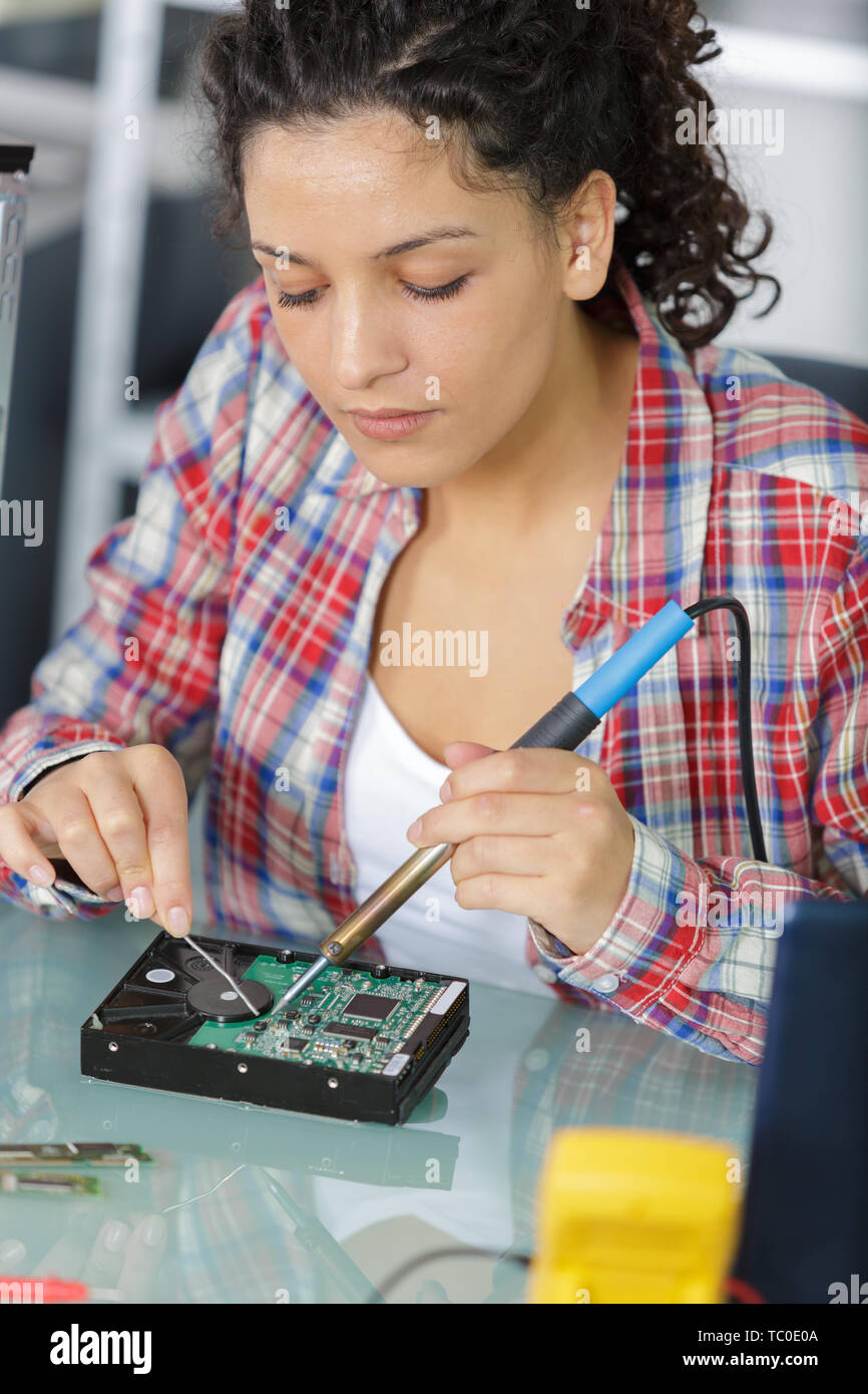 Woman soldering hi-res stock photography and images - Alamy