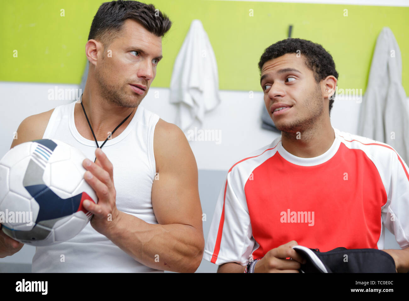 picture of football coach and player having conversation Stock Photo ...