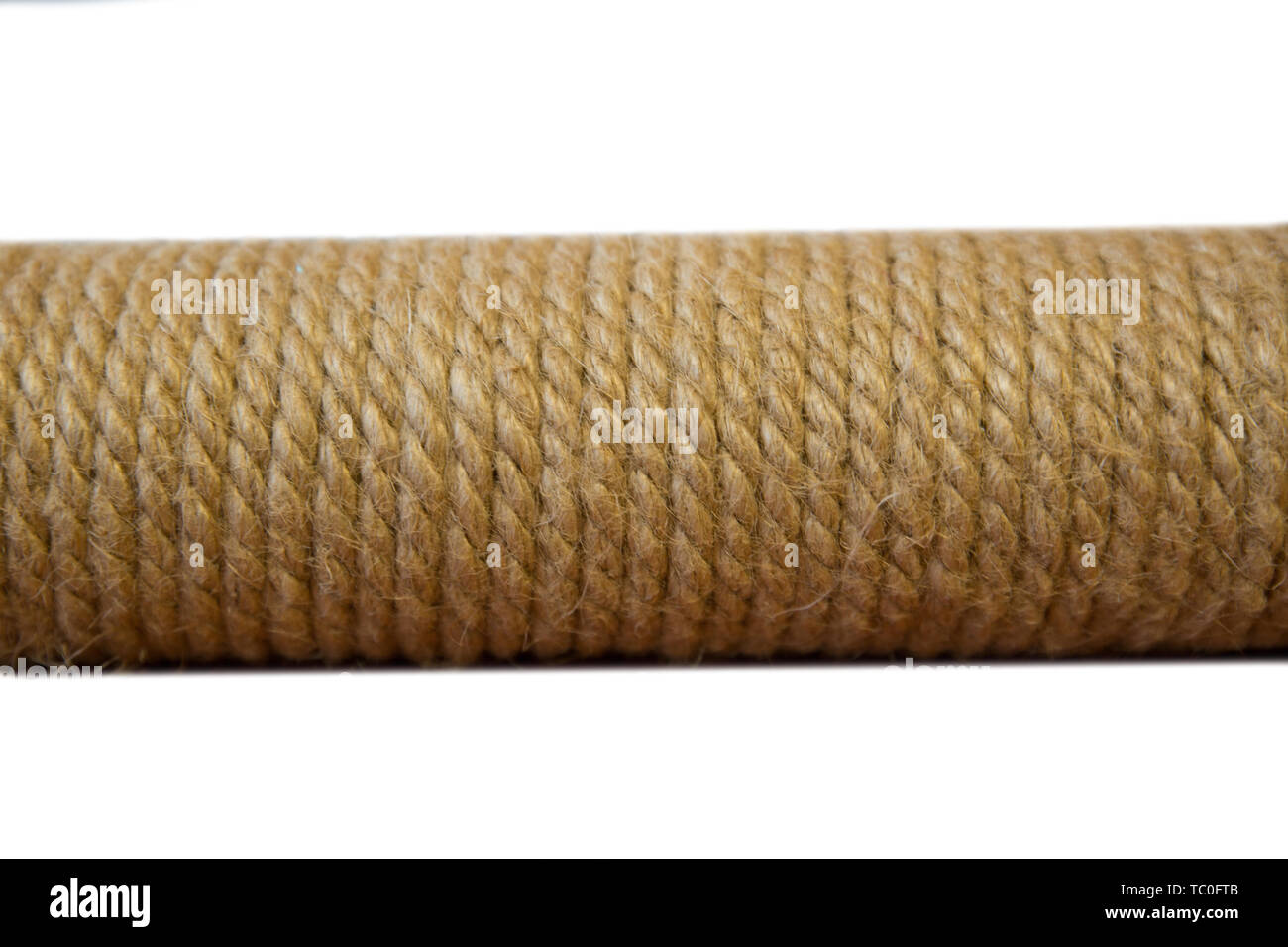 Rope tightly wound on a pipe for sharpening the claws of cats Stock ...