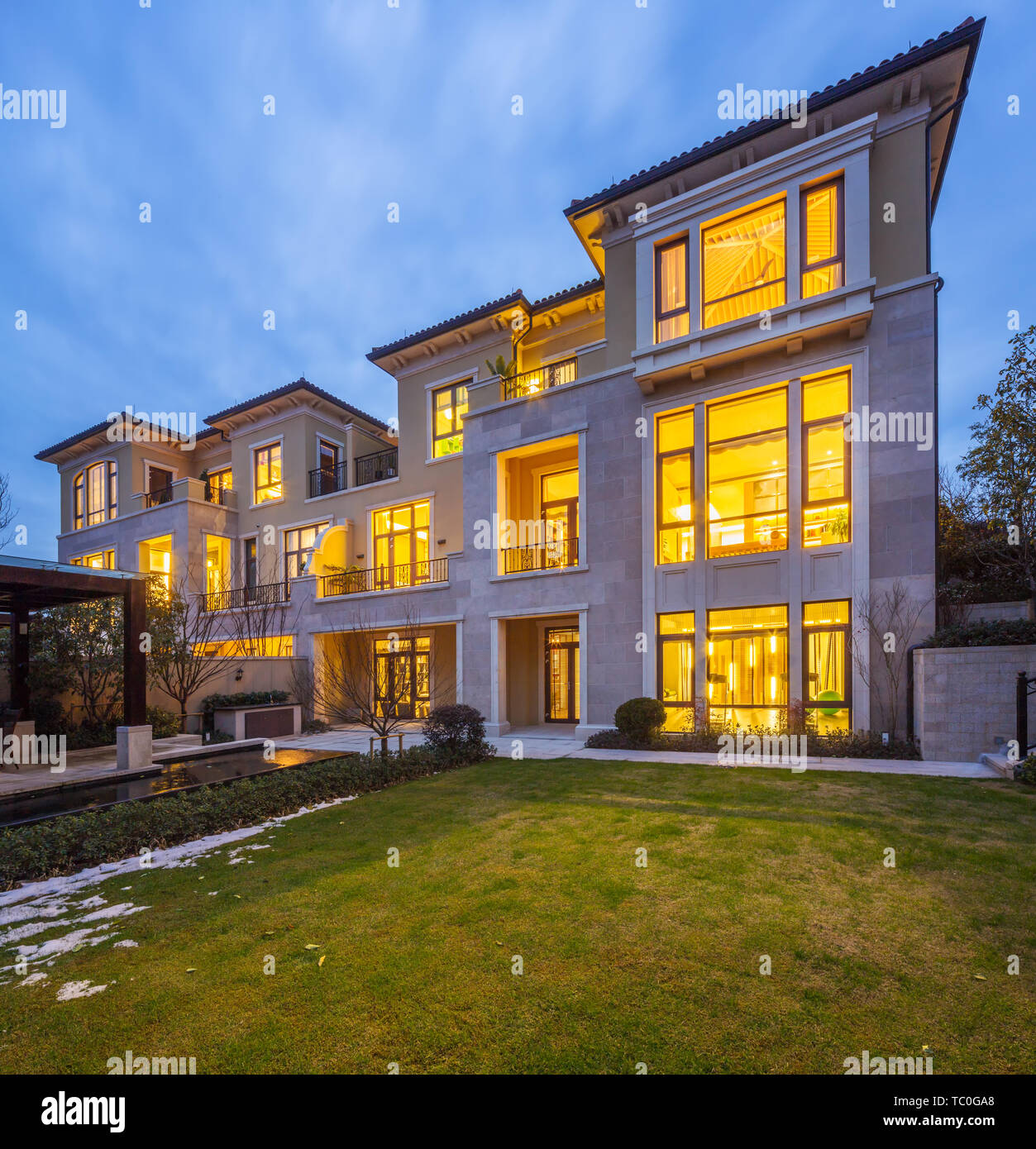Houses in modern villa at night Stock Photo - Alamy