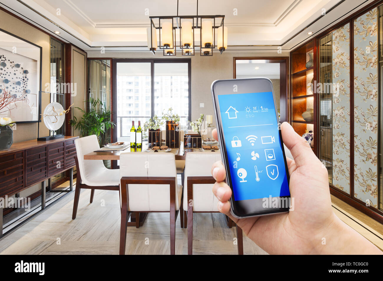 smart phone with smart home with modern dining room Stock Photo - Alamy