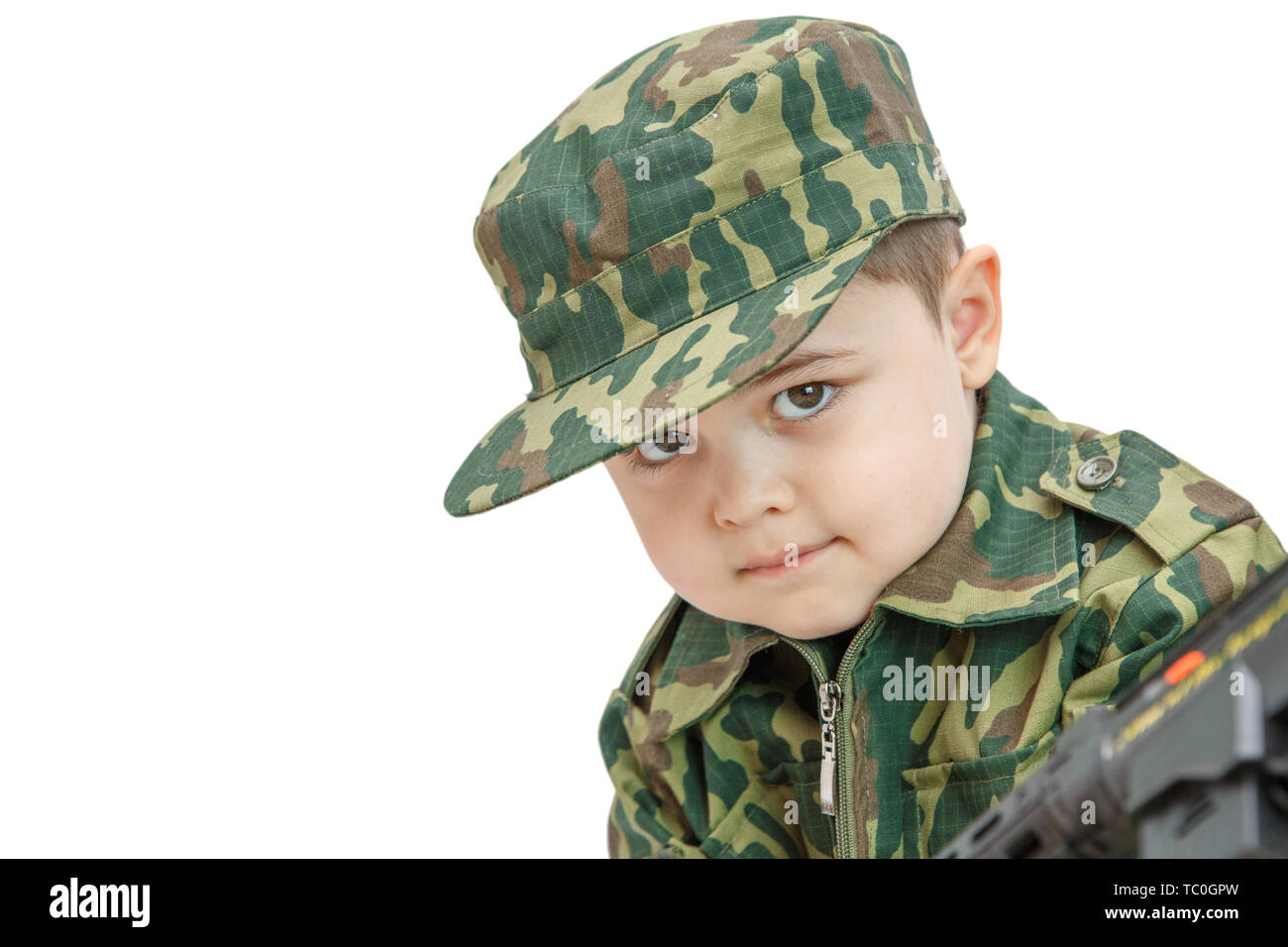 little Caucasian boy in military clothes isolated on light background ...