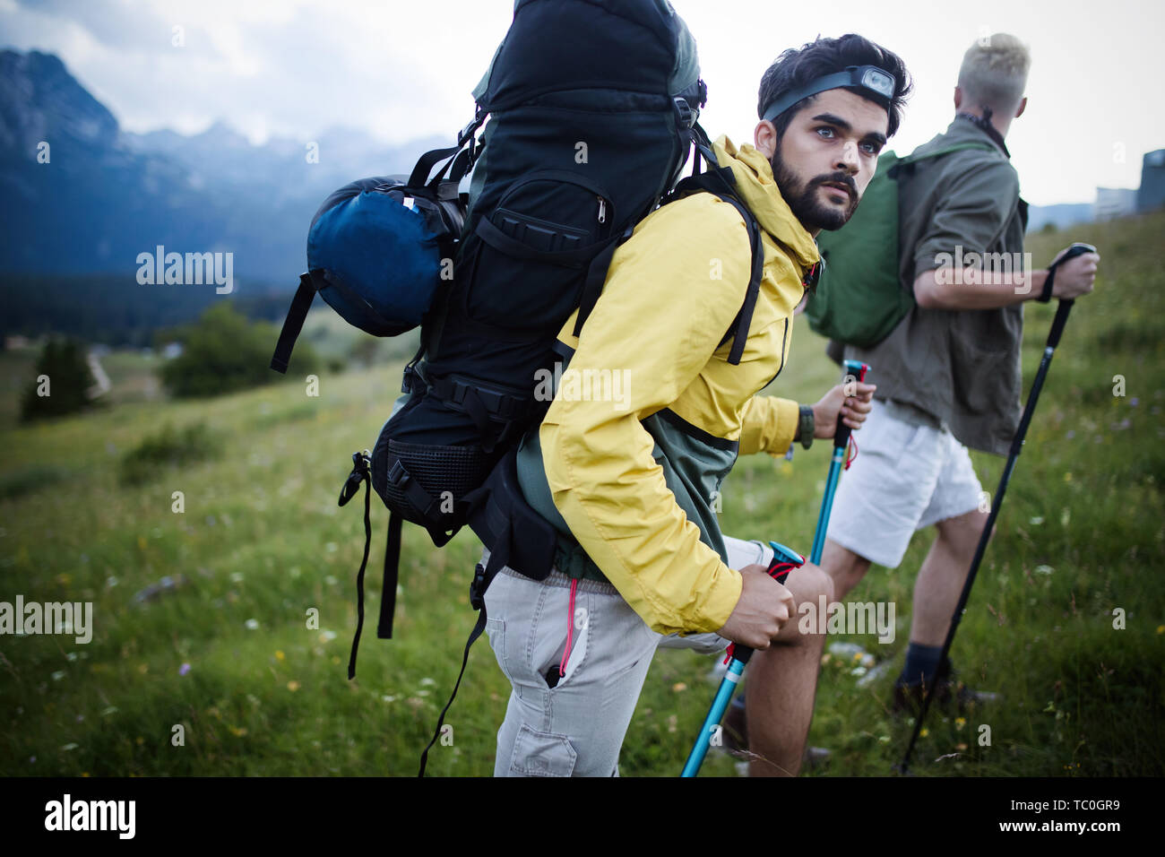 Men with trekking poles hi-res stock photography and images - Alamy