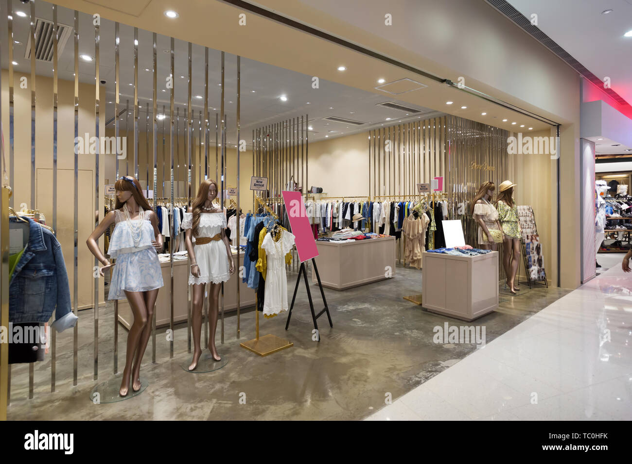 Boutique display window with mannequins in fashionable dresses Stock ...