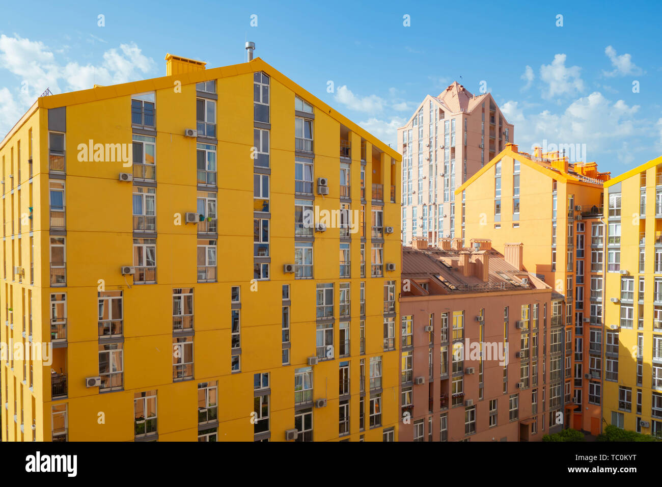 Beautiful modern houses painted in bright colors.Beautiful blue sky and ...