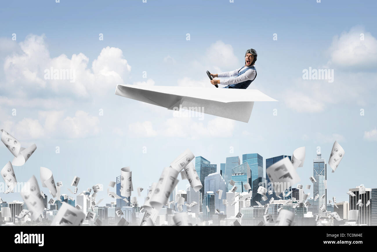 Screaming pilot sitting in paper plane Stock Photo - Alamy