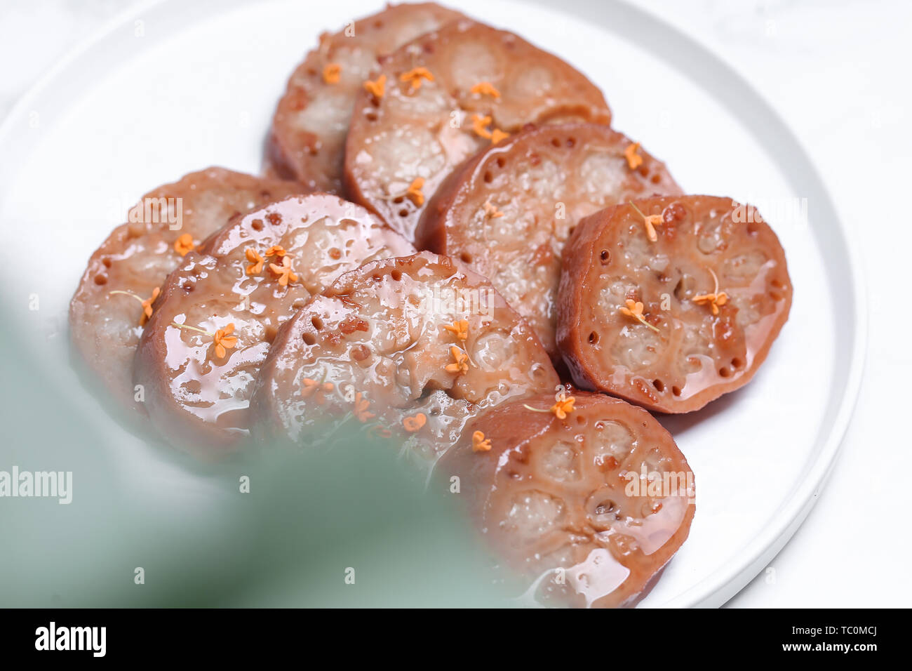 Traditional snack osmanthus glutinous rice lotus root Stock Photo - Alamy