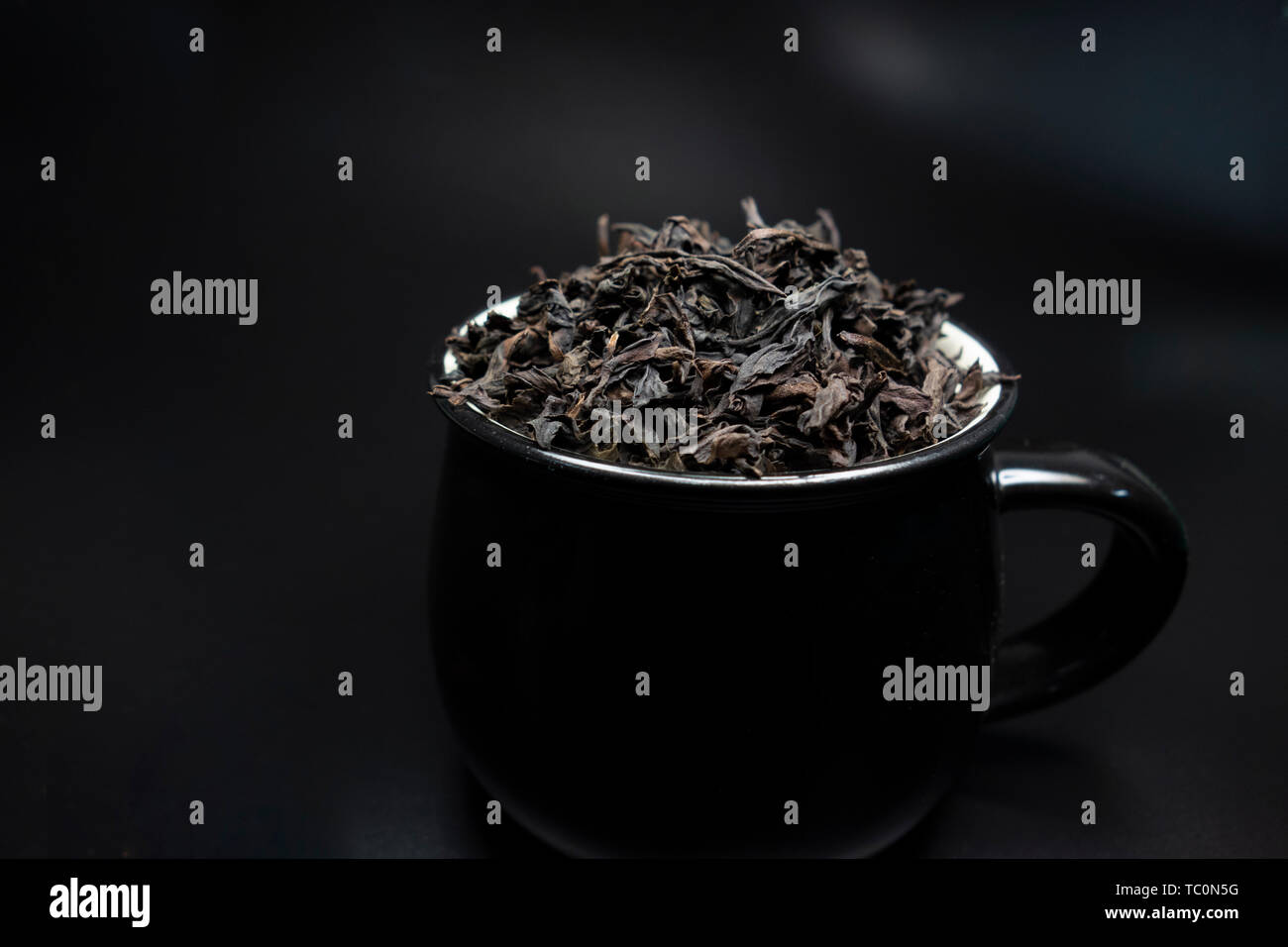 The cup is full of tea Stock Photo - Alamy