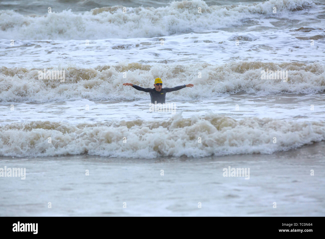 A swimmer in a big wave Stock Photo - Alamy