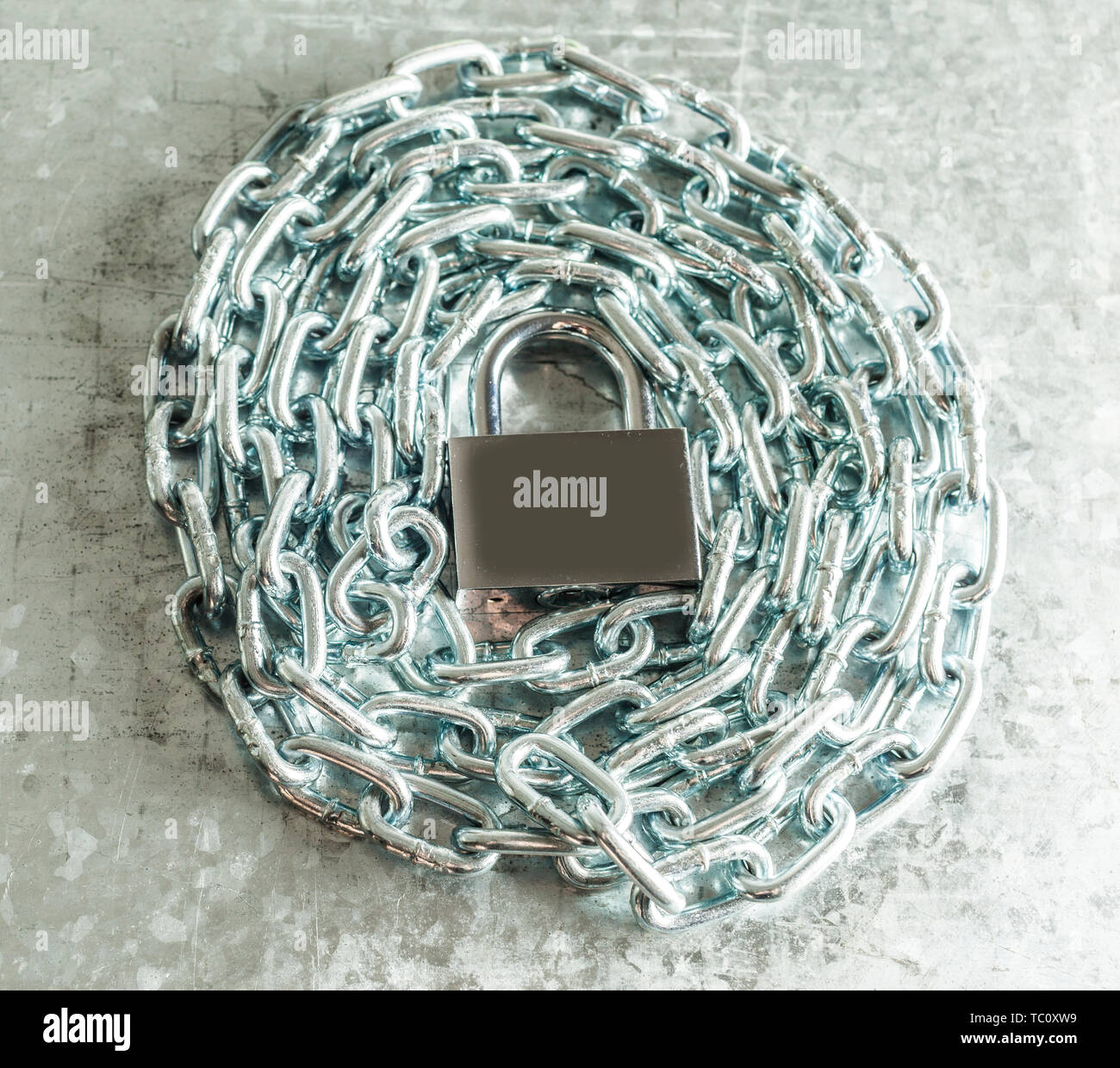 metal chain on metal plate Stock Photo - Alamy