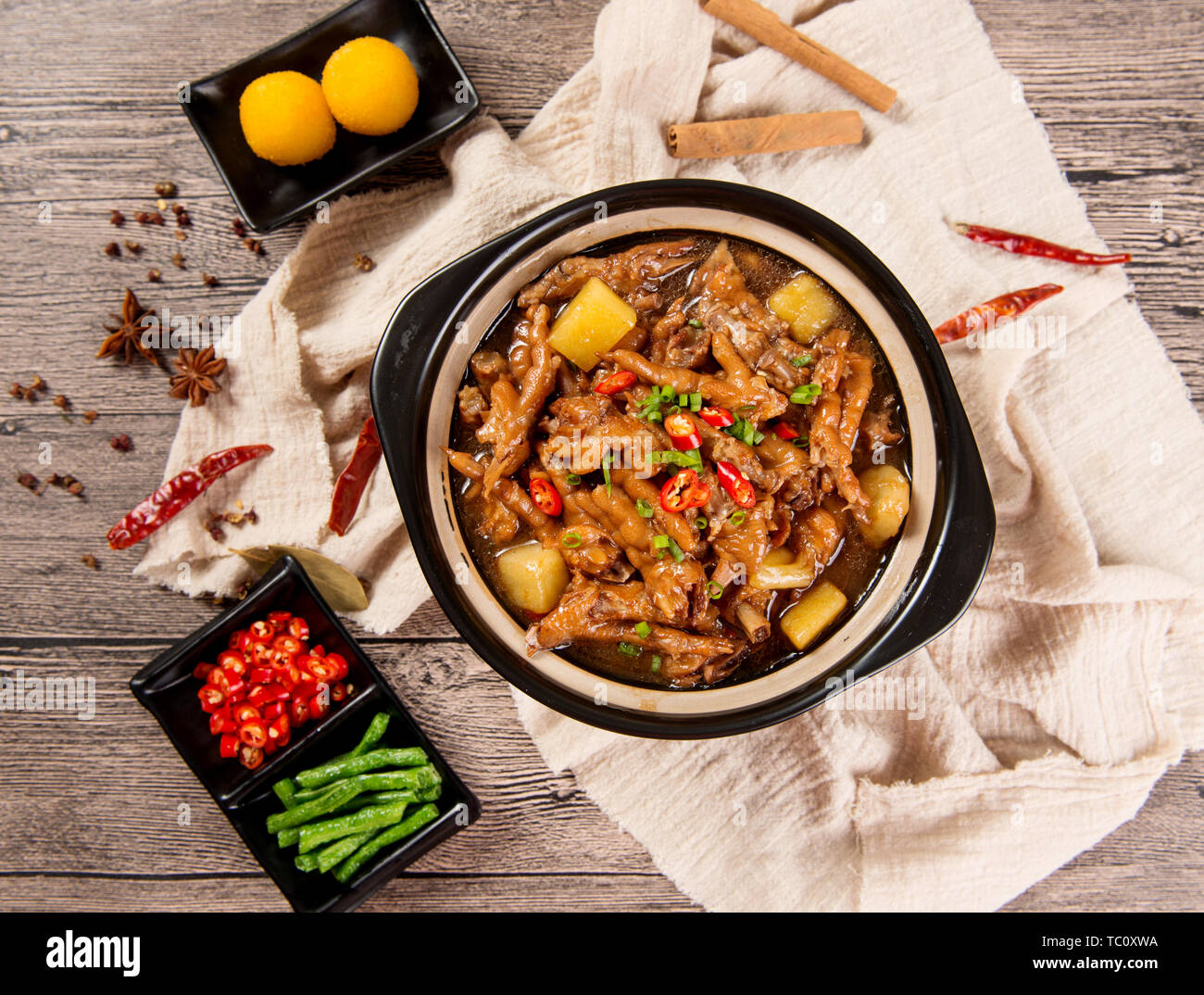 Spicy chicken claw cooker Stock Photo - Alamy