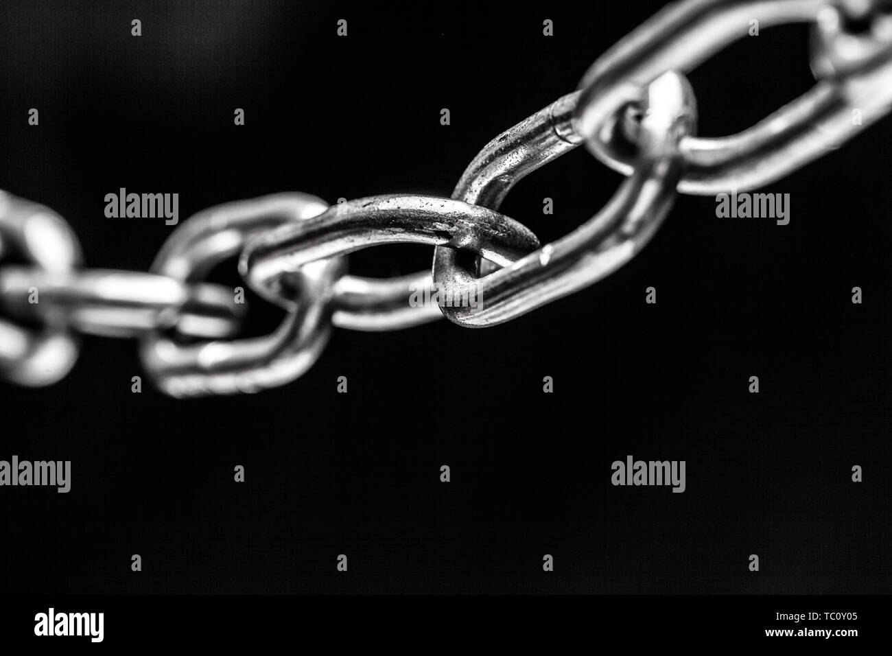 Strong chain black background Stock Photo - Alamy