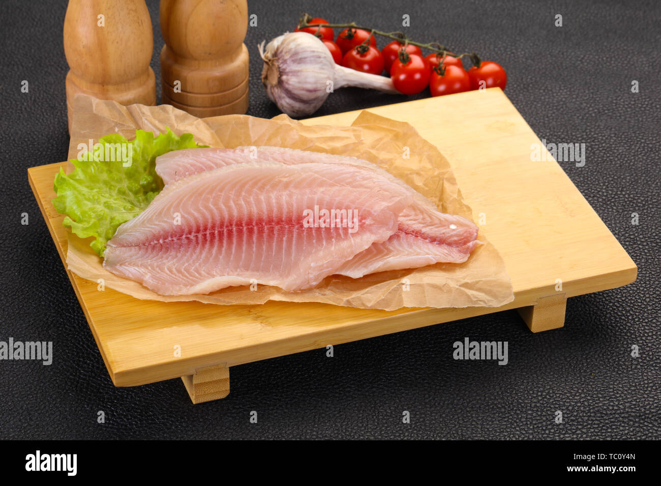 Raw tilapia fish ready for cooking Stock Photo - Alamy