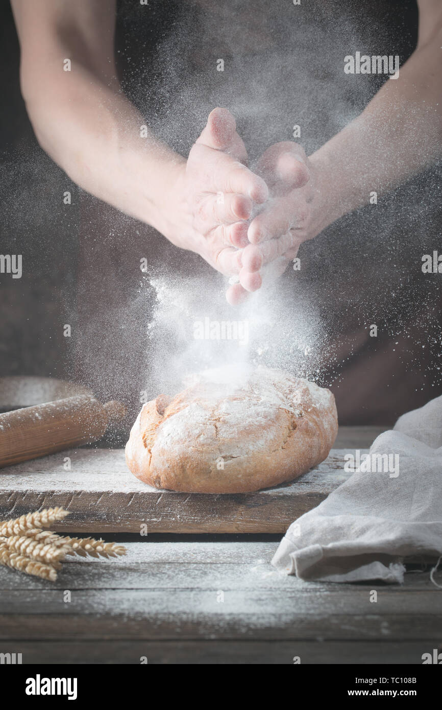 Baker cooking bread Stock Photo - Alamy