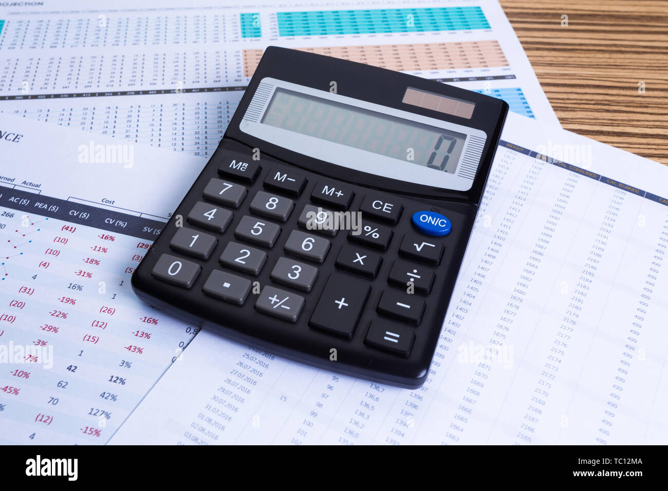 Graphs and Calculator Stock Photo - Alamy