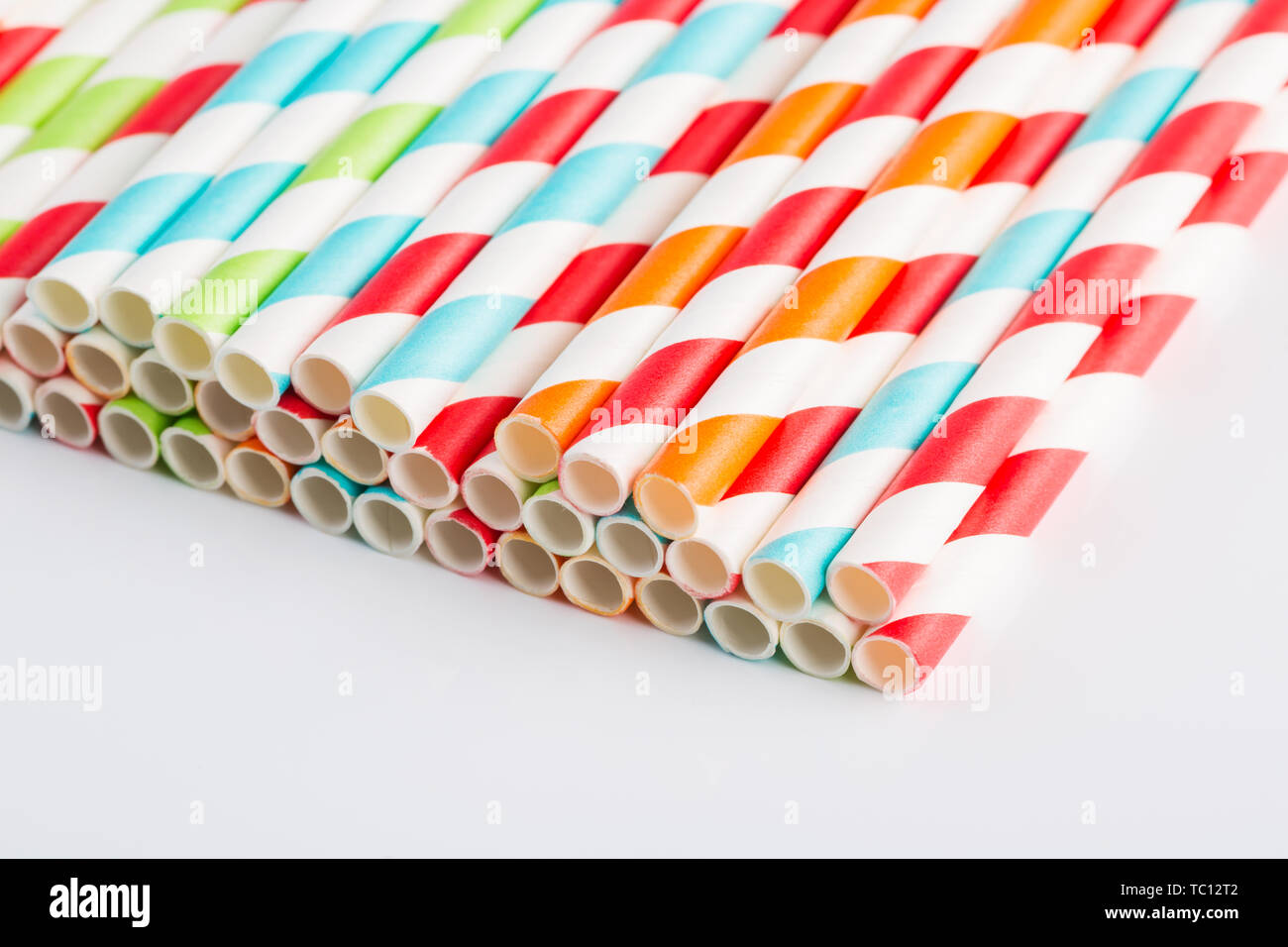 Colored striped paper straw on white background, close-up Stock Photo ...