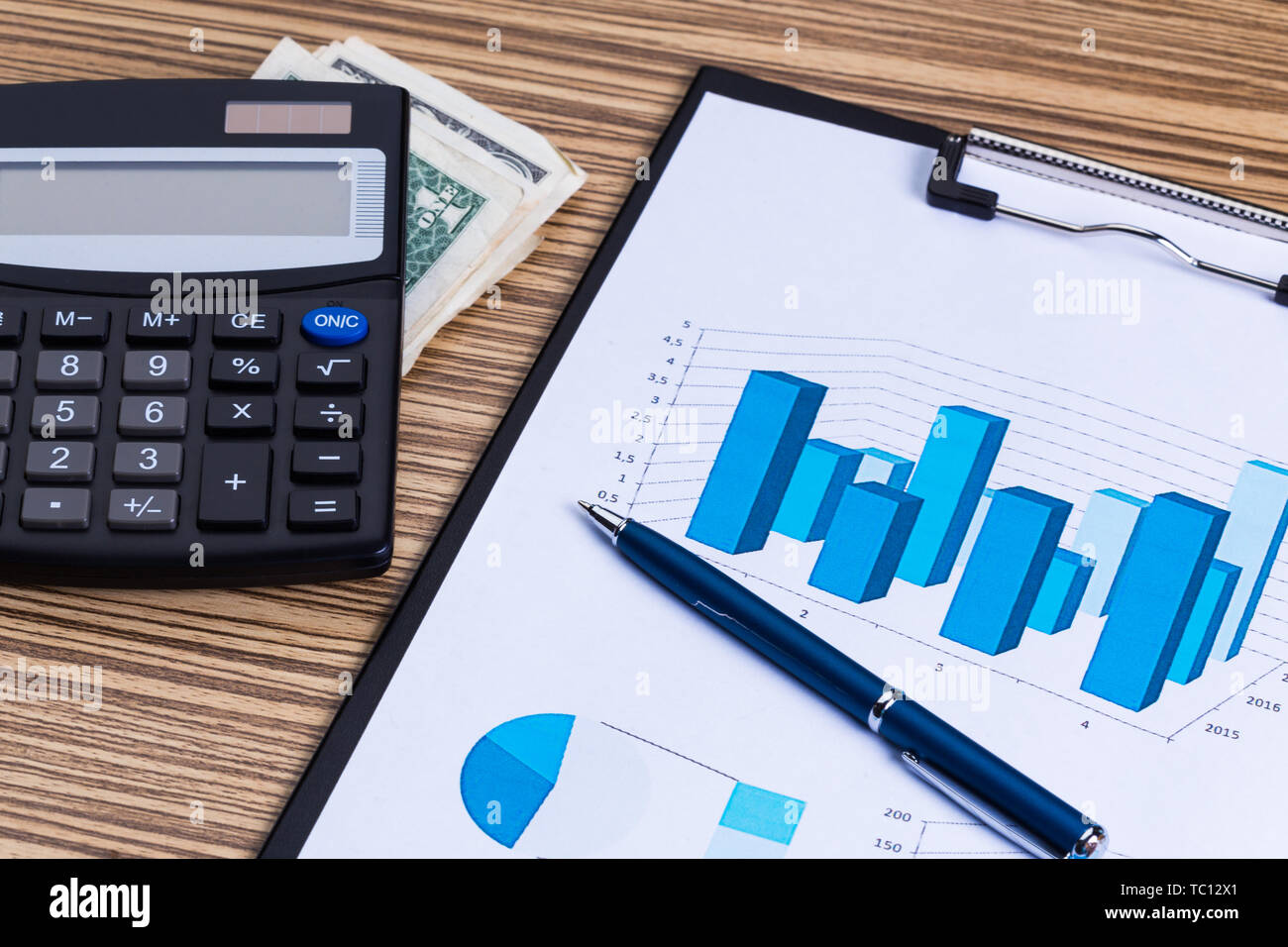 Graphs and Calculator Stock Photo - Alamy