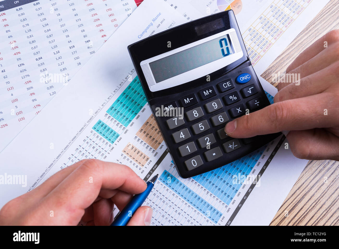Graphs and Calculator Stock Photo - Alamy