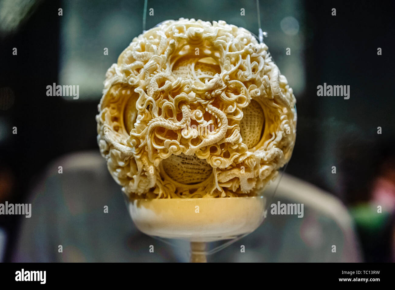 Qing Dynasty carved ivory cloud dragon pattern ball Stock Photo - Alamy