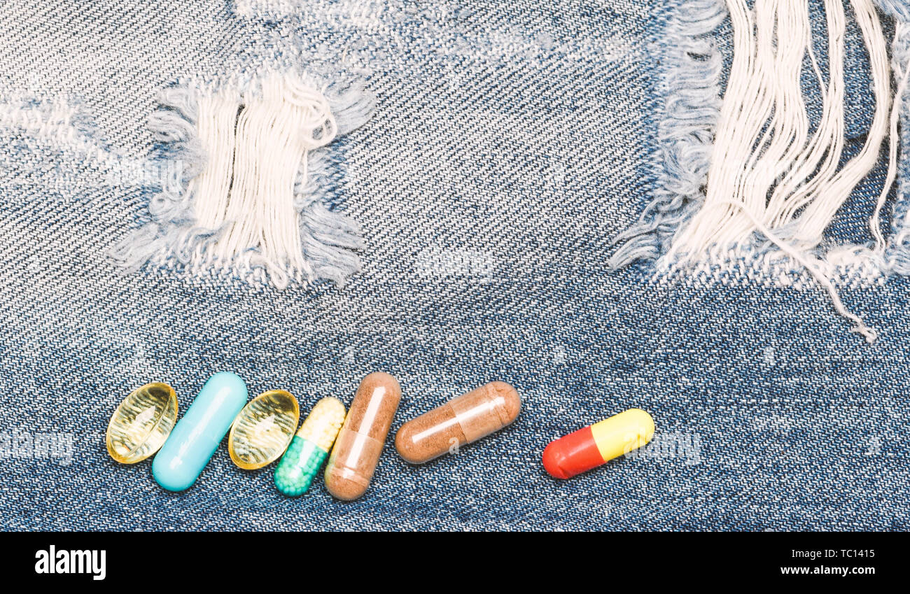 Medicine and treatment concept. Drugs on denim background. Set of ...