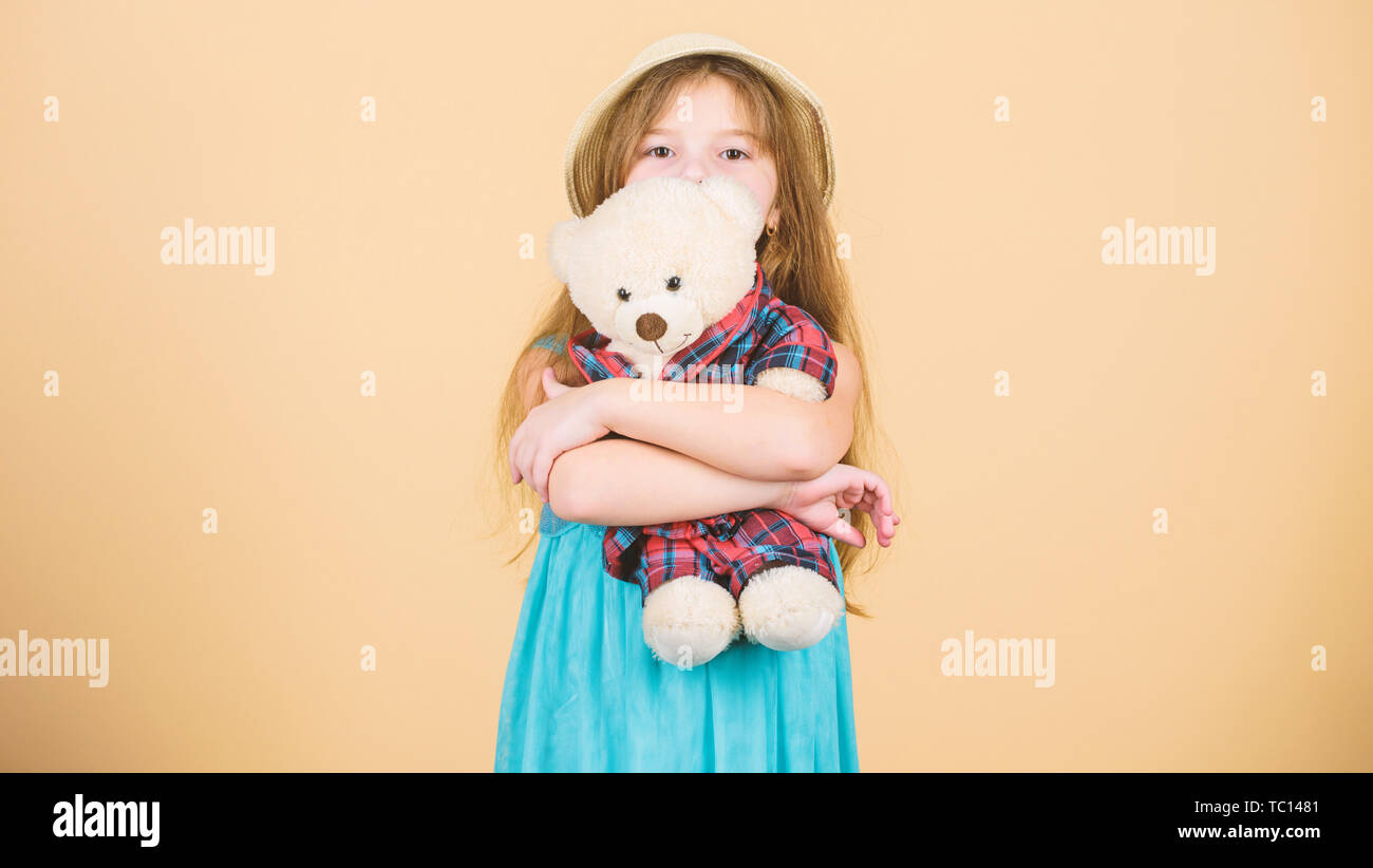 Her favorite toy. Little girl holding soft toy. Small child cuddling ...