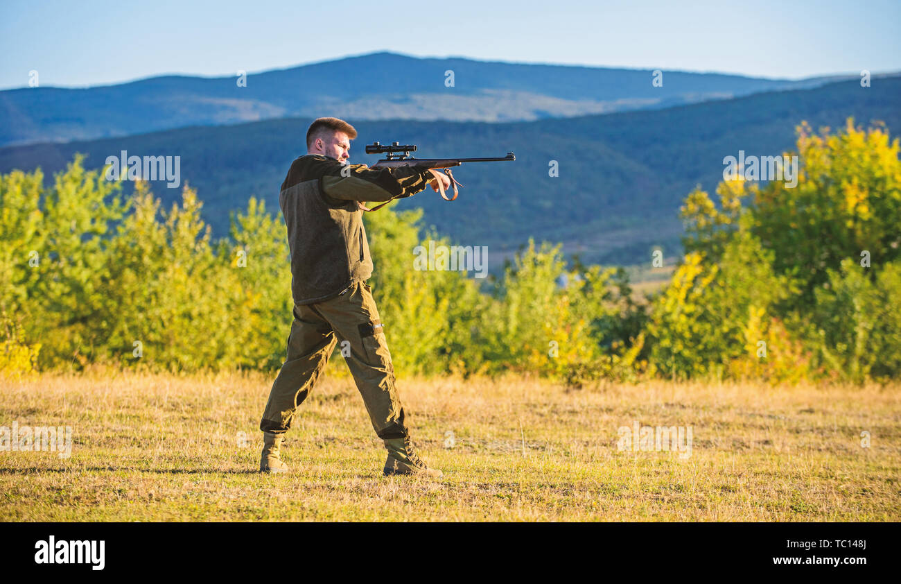 Hunter with rifle looking for animal. Hunting shooting trophy. Man ...