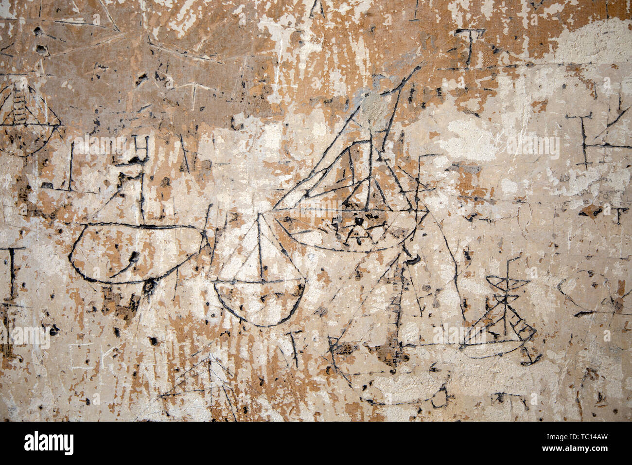 Scratched pictures of boats sailing ships on wall in church at Tunstall ...