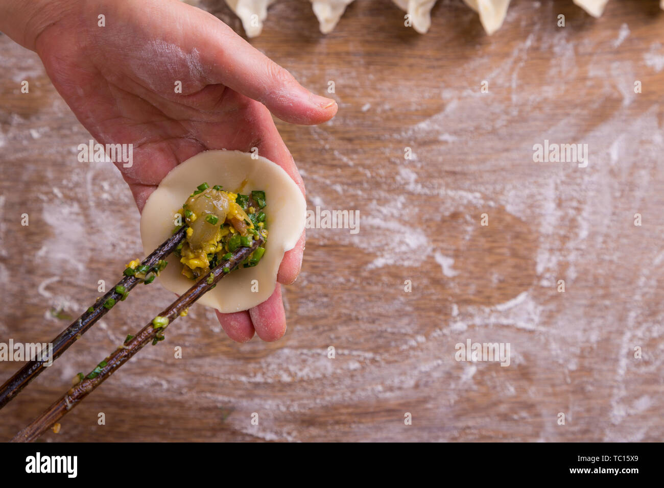 Hand making dumplings Stock Photo - Alamy