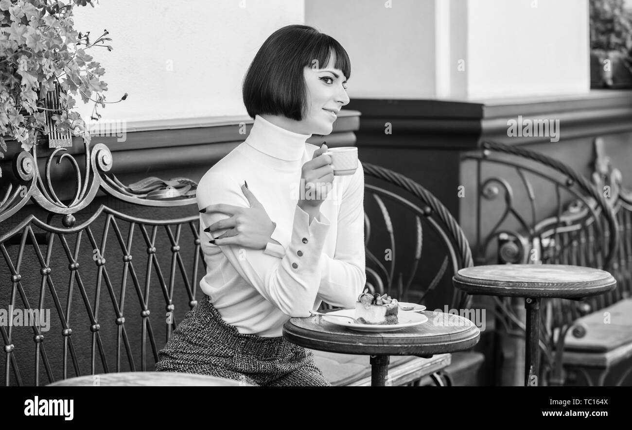 Woman attractive elegant brunette eat gourmet cake cafe terrace ...