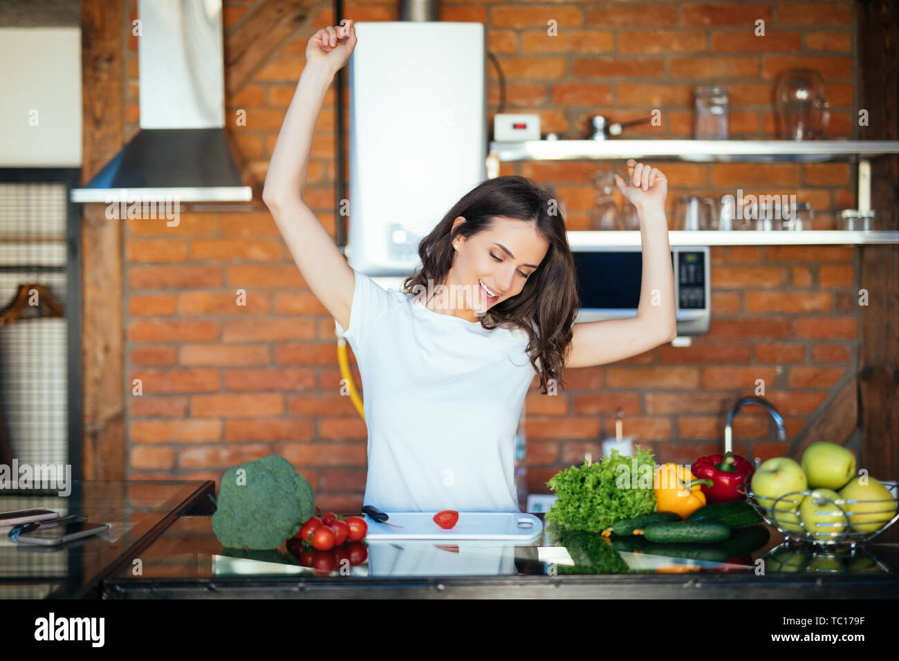 happy woman cooking in kitchen room at home Stock Photo - Alamy