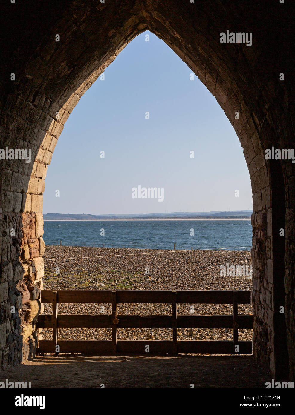Stone arch of old lime kilns on Holy Island, Northumberland, England ...