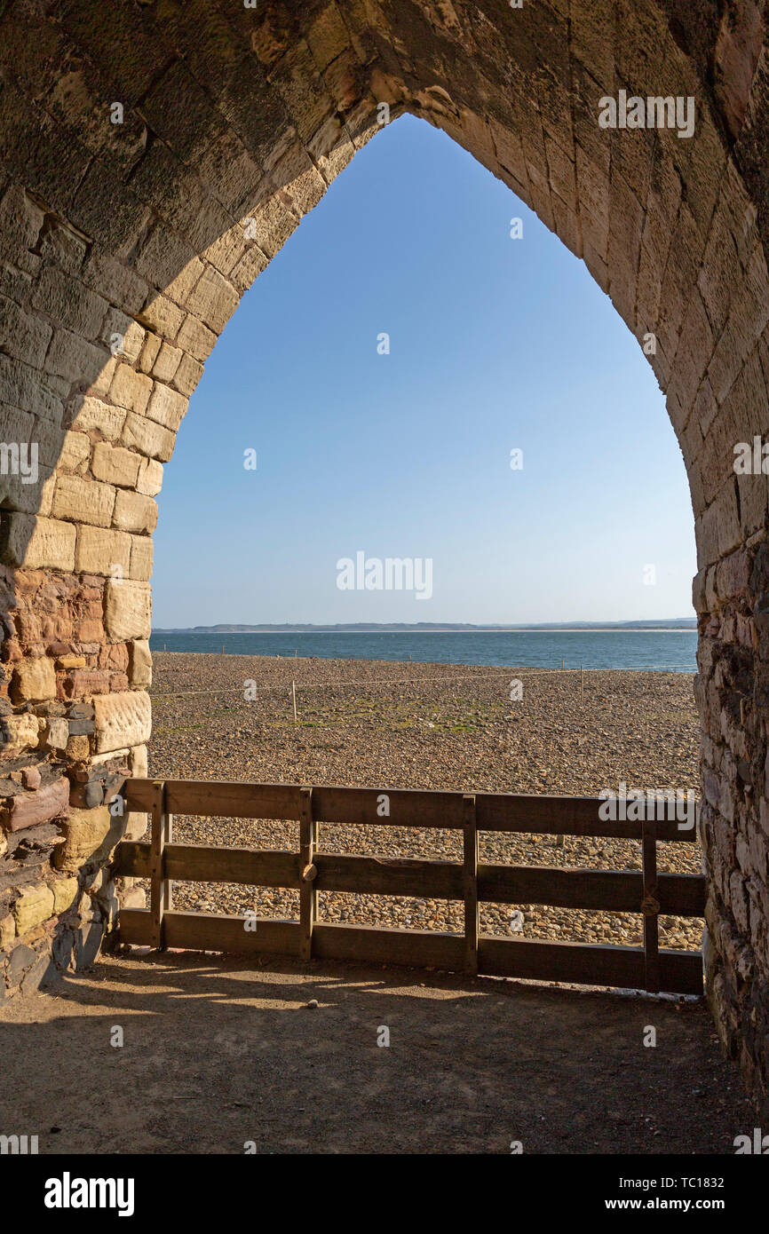 Stone arch of old lime kilns on Holy Island, Northumberland, England ...