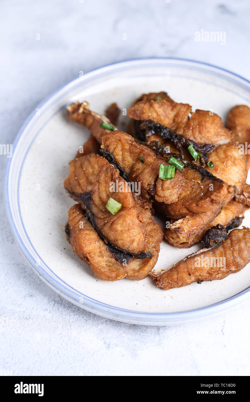 Fried crisp fish Stock Photo - Alamy
