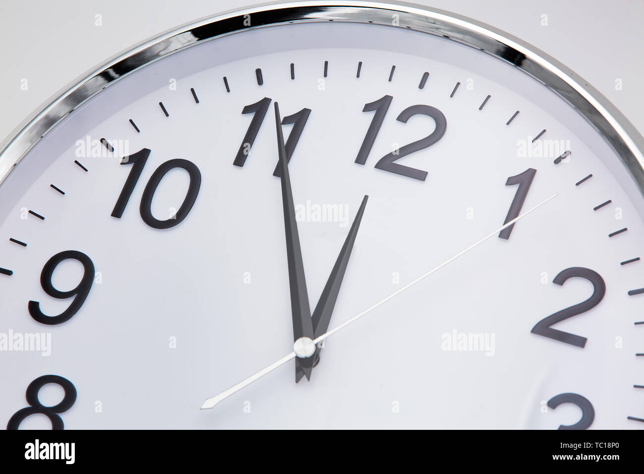 Clock on white background Stock Photo - Alamy