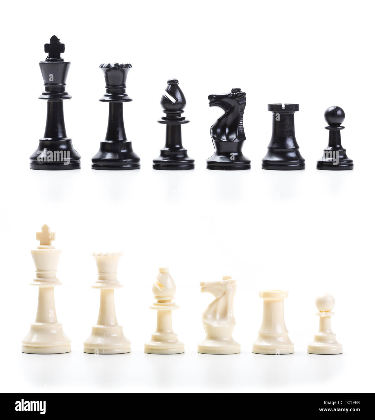 wooden chess set lined up in rows isolated Stock Photo - Alamy